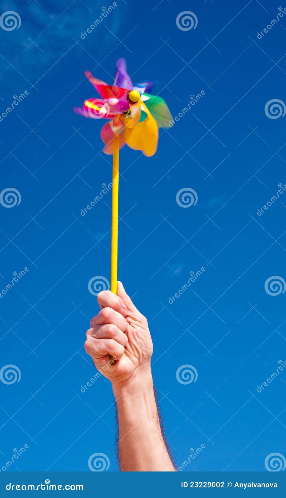 Toy windmill over blue sky stock photo. Image of background - 23229002