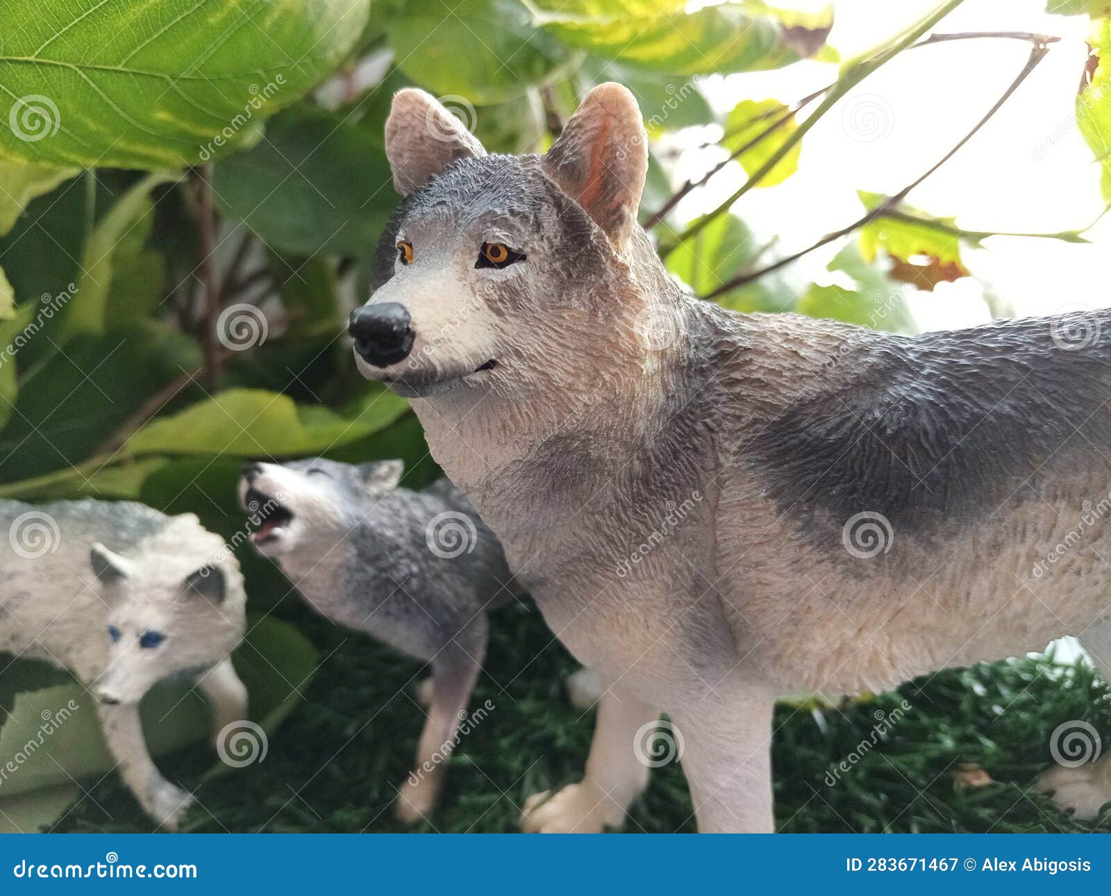 Toy Wolf Figures in a Forest Setting with Trees Stock Image - Image of ...