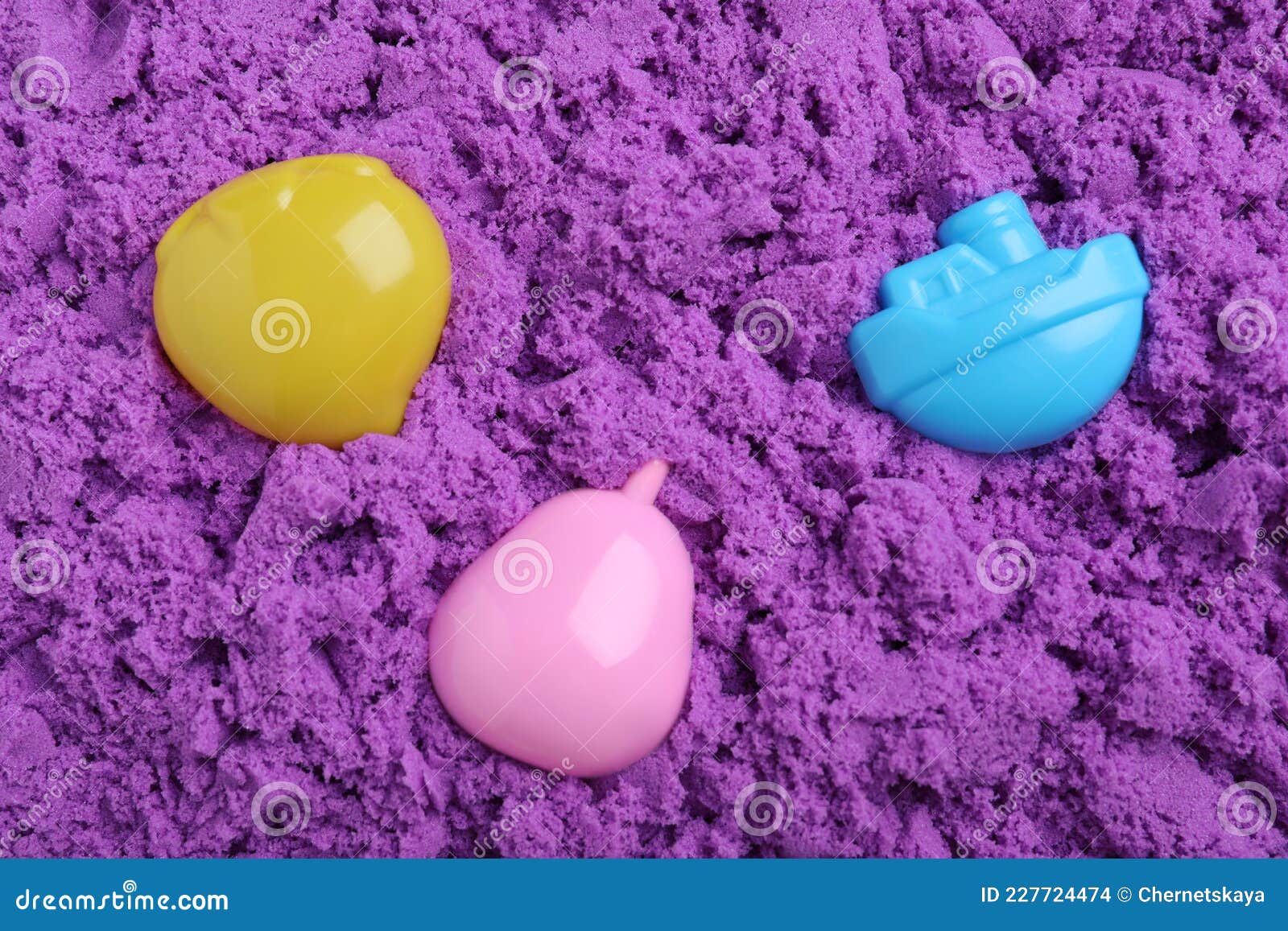 Toys on Violet Kinetic Sand, Flat Lay Stock Photo - Image of material ...