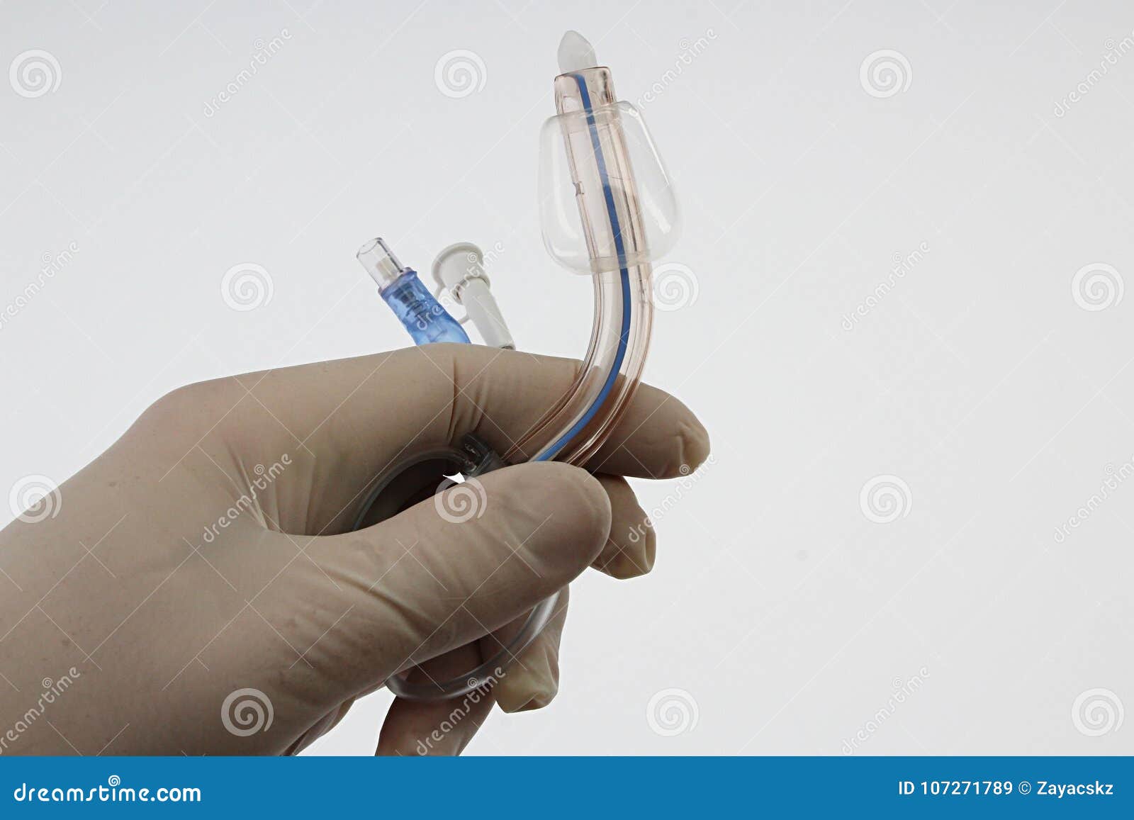 Tracheostomy Cannula With Inflated Cuff Held In Doctor Left Hand In ...