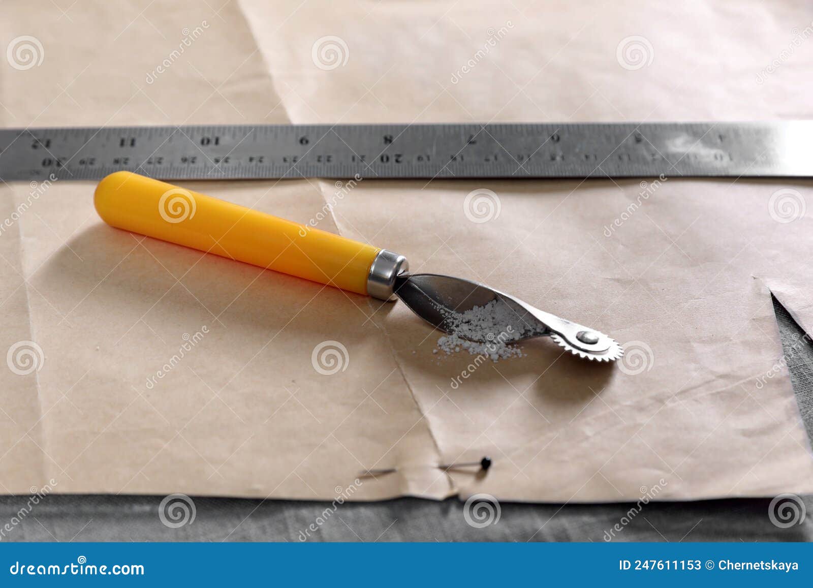 Tracing Wheel and Ruler with Sewing Pattern on Fabric, Closeup Stock ...