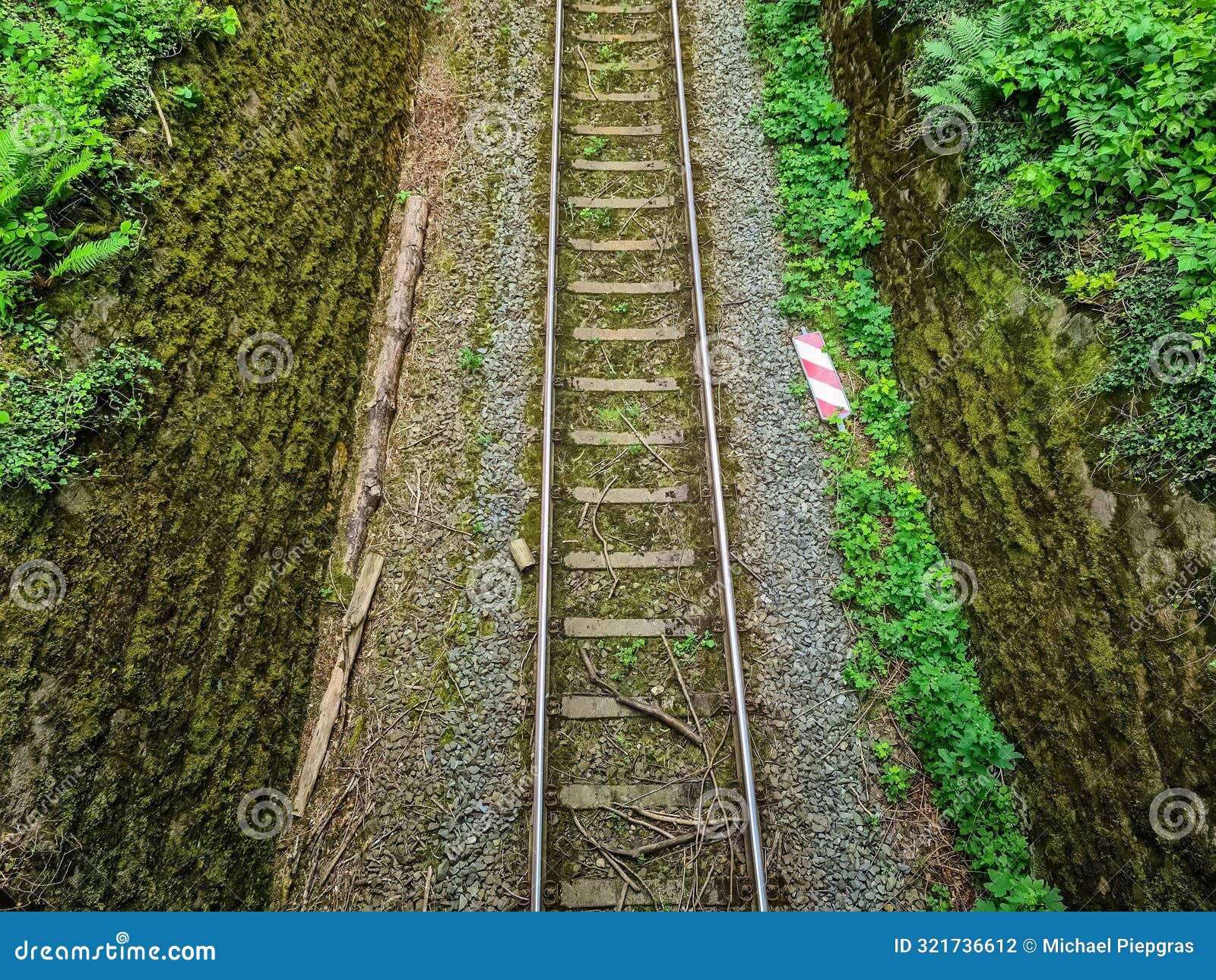 A Track Bed for Trains in a Forest with Walls on Both Sides Stock Photo ...