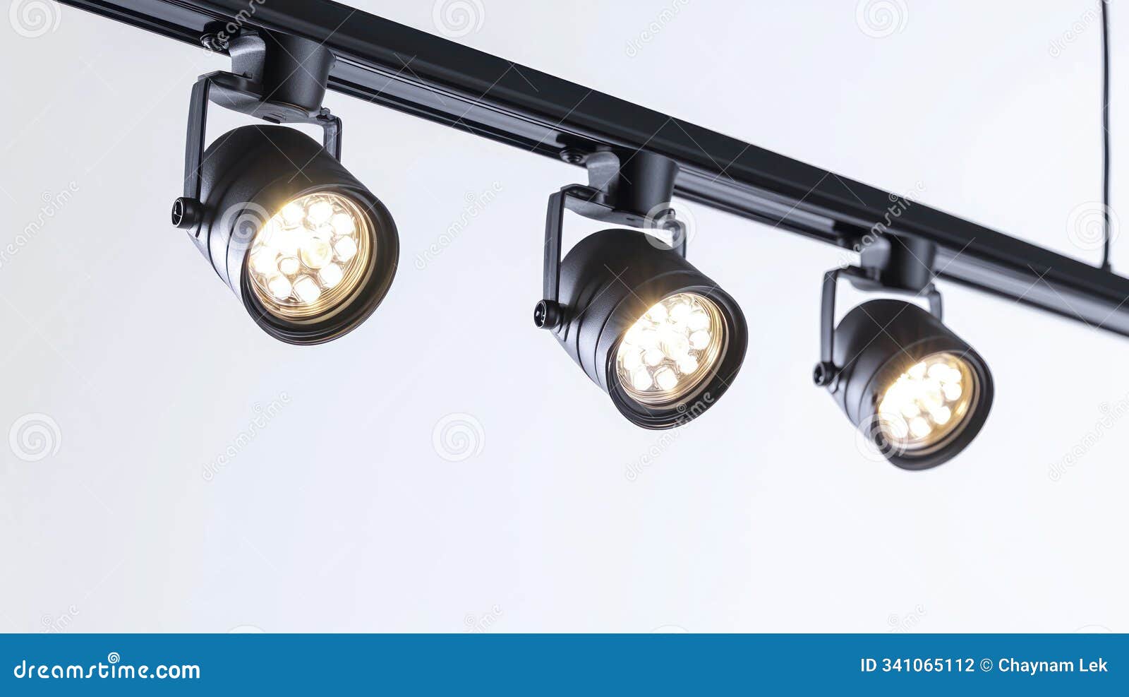 Track Lighting Fixture Is Casting Bright Light Beams Stock Photography ...