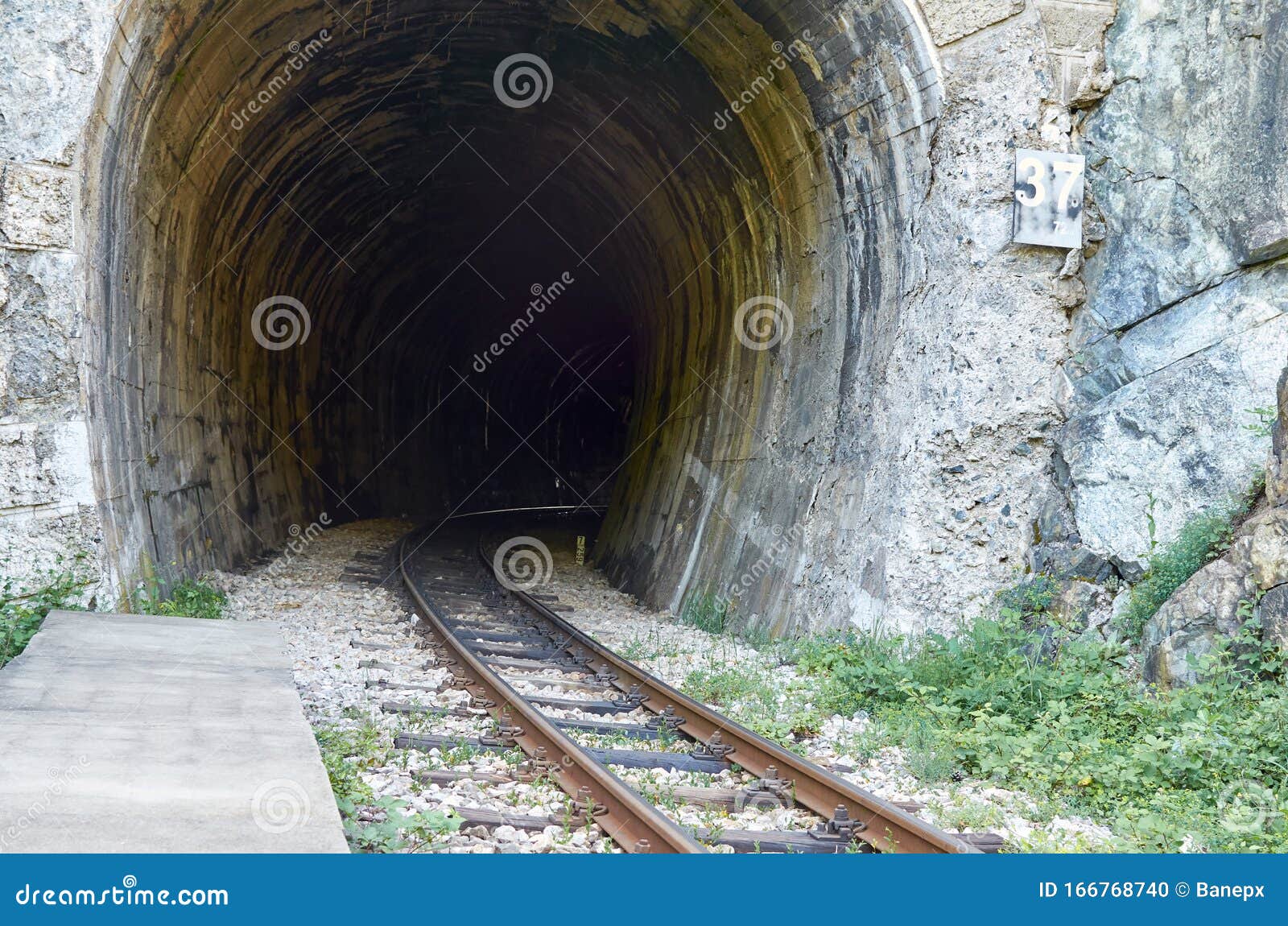 Track through a tunnel stock photo. Image of infrastructure - 166768740