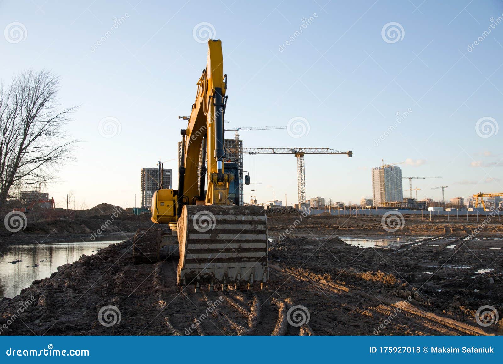 Track-type Excavator during Earthmoving at Construction Site. Backhoe ...