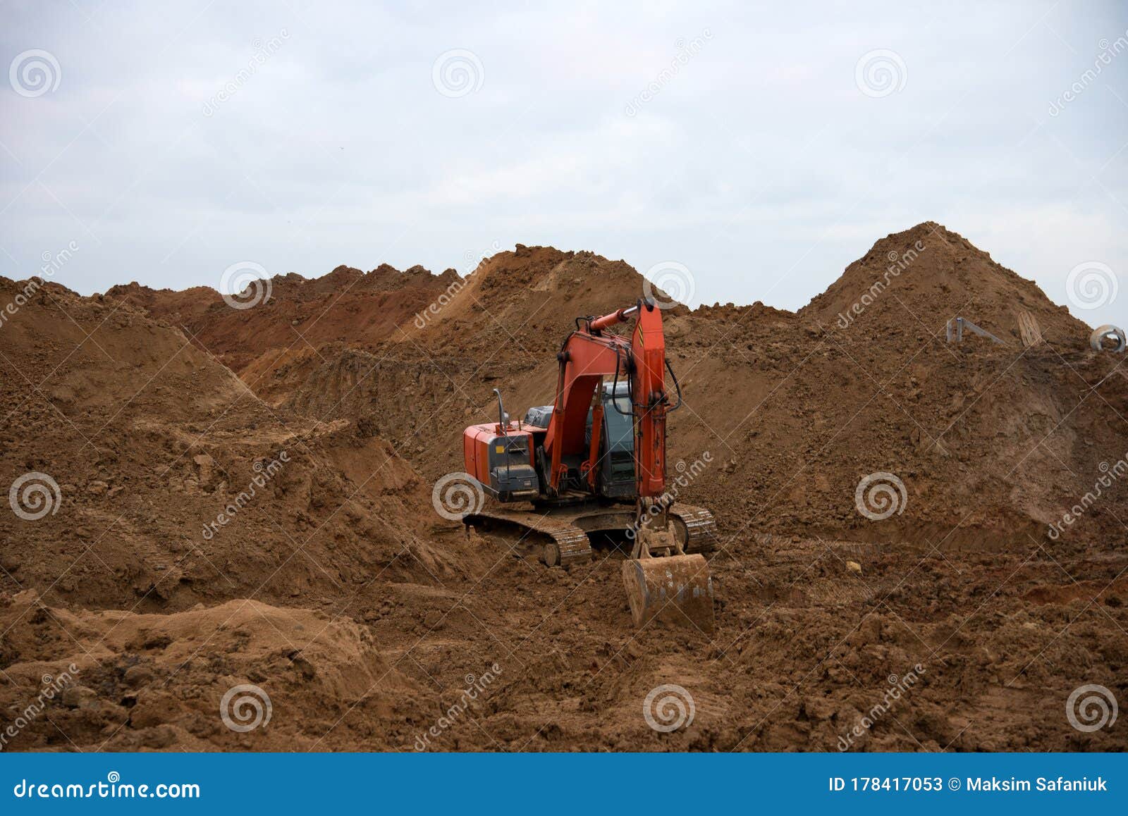 Track-type Excavator during Earthmoving at Construction Site. Backhoe ...