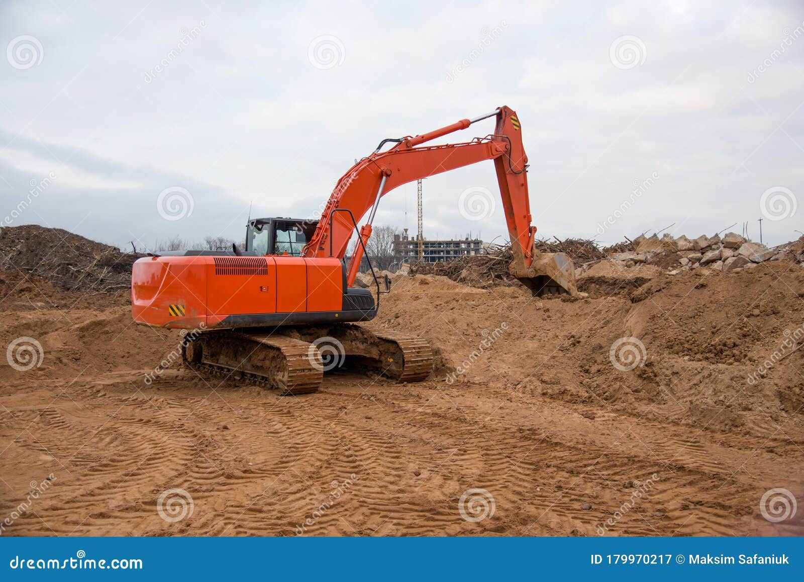 Track-type Excavator during Earthmoving at Construction Site. Backhoe ...