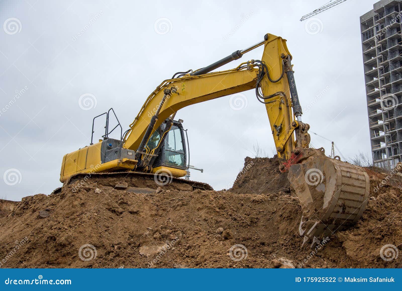 Track-type Excavator during Earthmoving at Construction Site. Backhoe ...