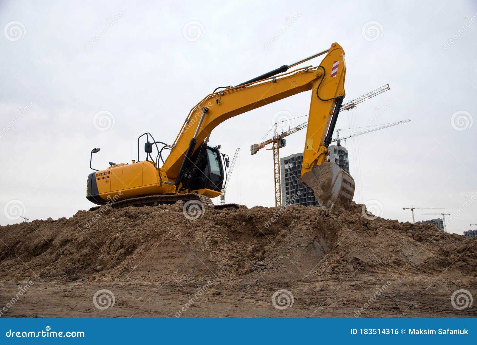 Track-type Excavator during Earthmoving at Construction Site. Backhoe ...