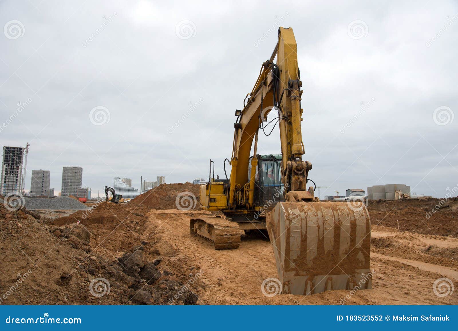 Track-type Excavator during Earthmoving at Construction Site. Backhoe ...