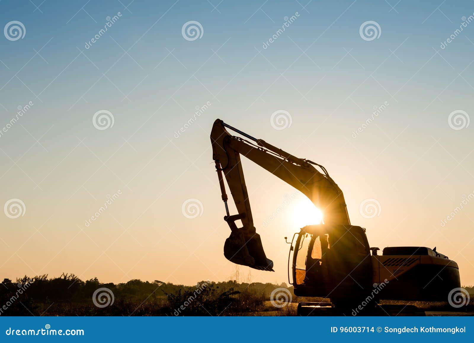 Track-type Loader Excavator Machine on Sunset Background Stock Photo ...