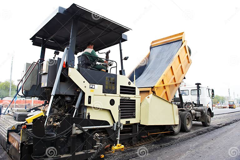 Tracked asphalt paver stock photo. Image of bituman, loading - 19839040