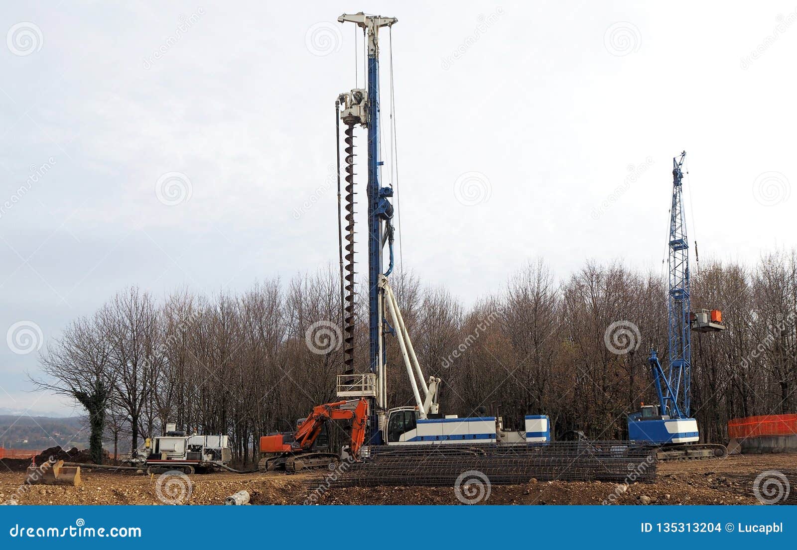 A Tracked Auger Piling Rig, a Mobile Crane and an Excavator at the ...