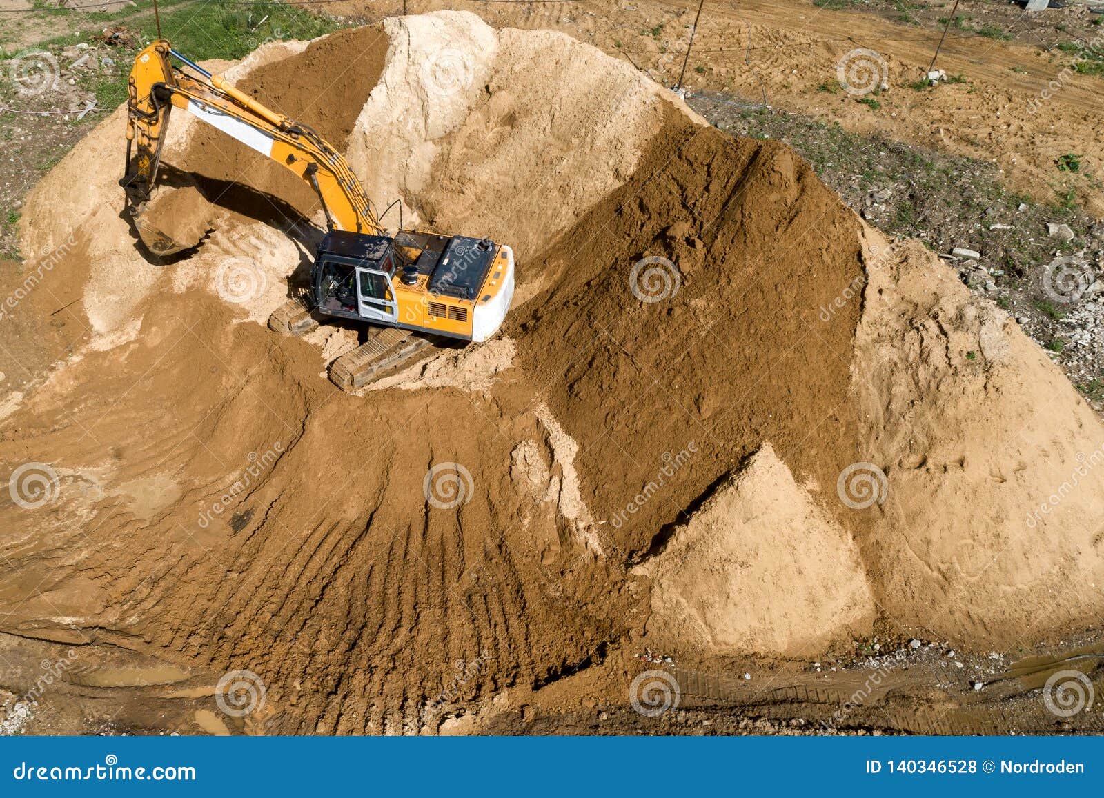 Tracked Excavator Overloads the Sand from the Embankment Stock Photo ...