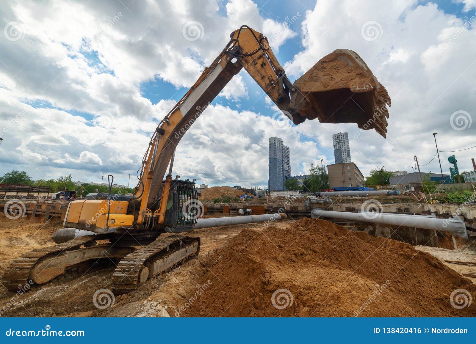Tracked Excavator with Raised Bucket. Modern Earthmoving Equipment ...