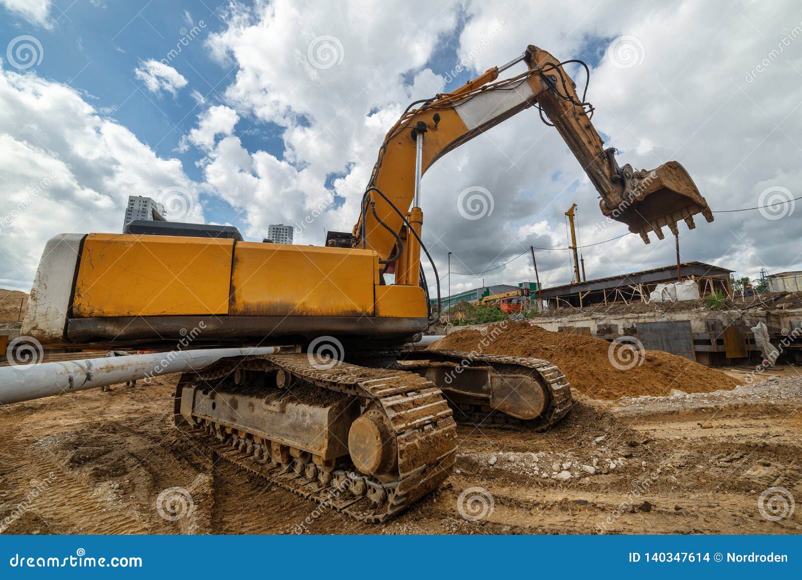 Tracked Excavator with Raised Bucket. Modern Earthmoving Equipment ...