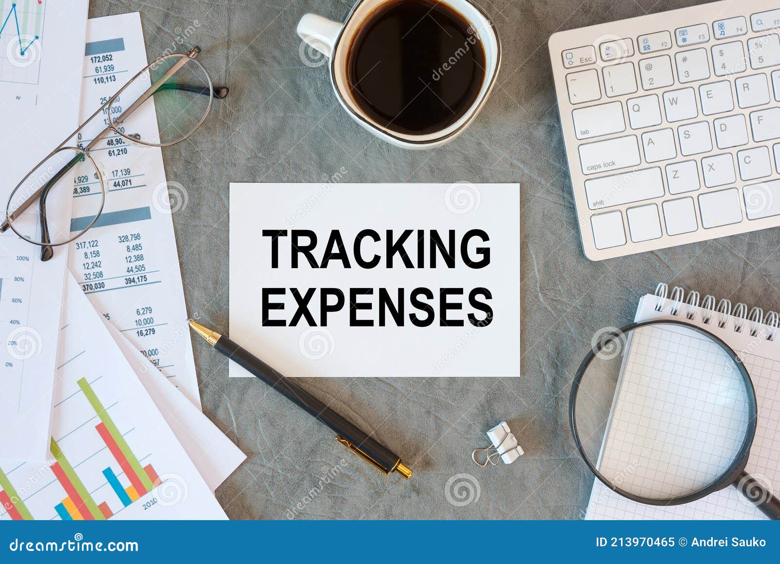 Tracking Expenses is Written in a Document on the Office Desk, Keyboard ...