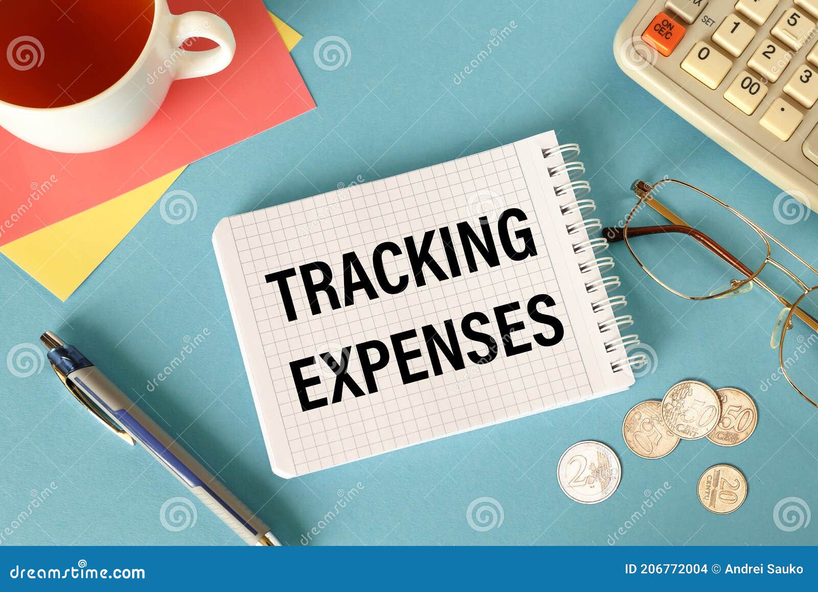 TRACKING EXPENSES is Written on a Notepad on an Office Desk Stock Photo ...