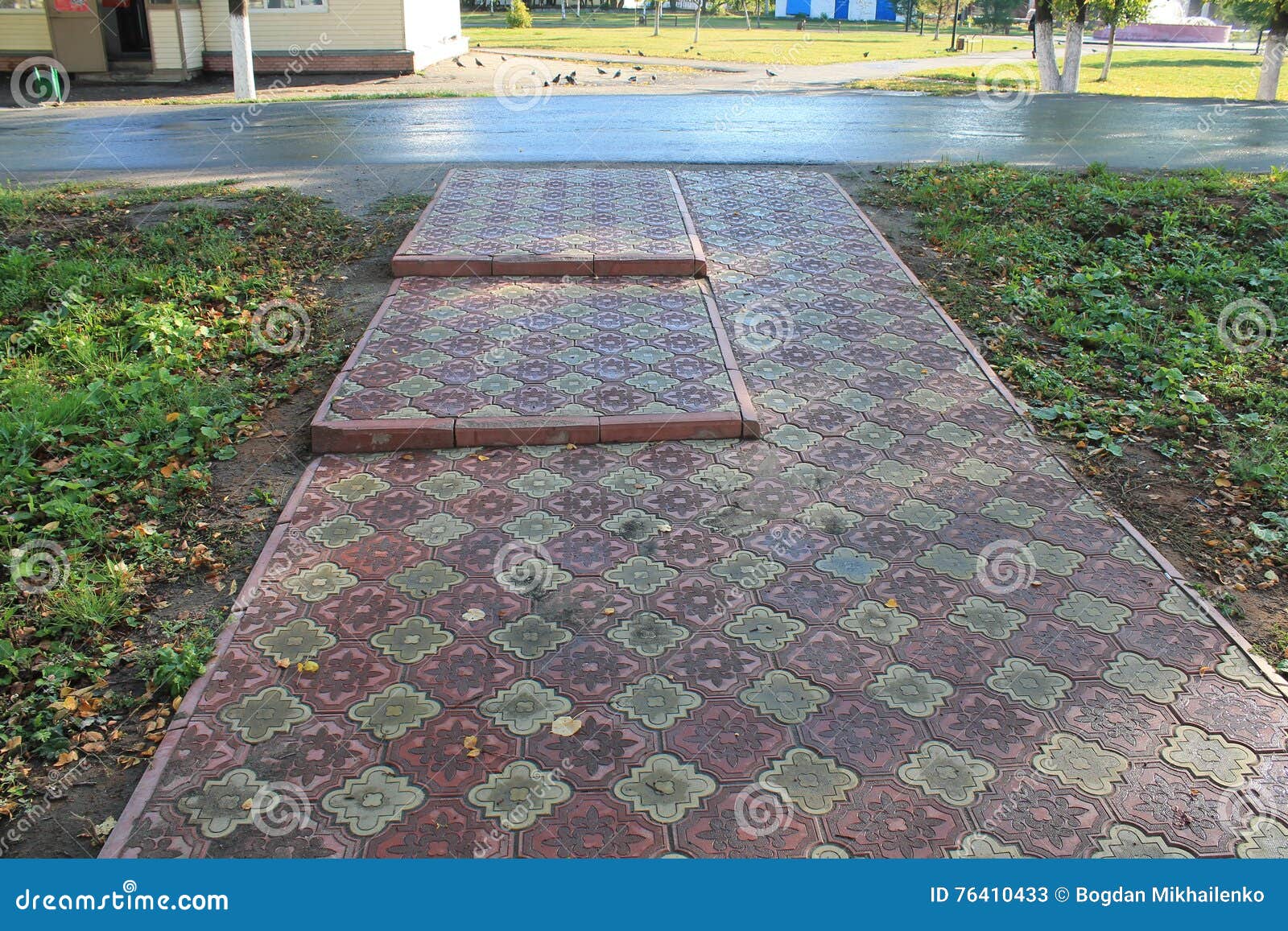 Tracks from tiles stock image. Image of pavers, tile - 76410433
