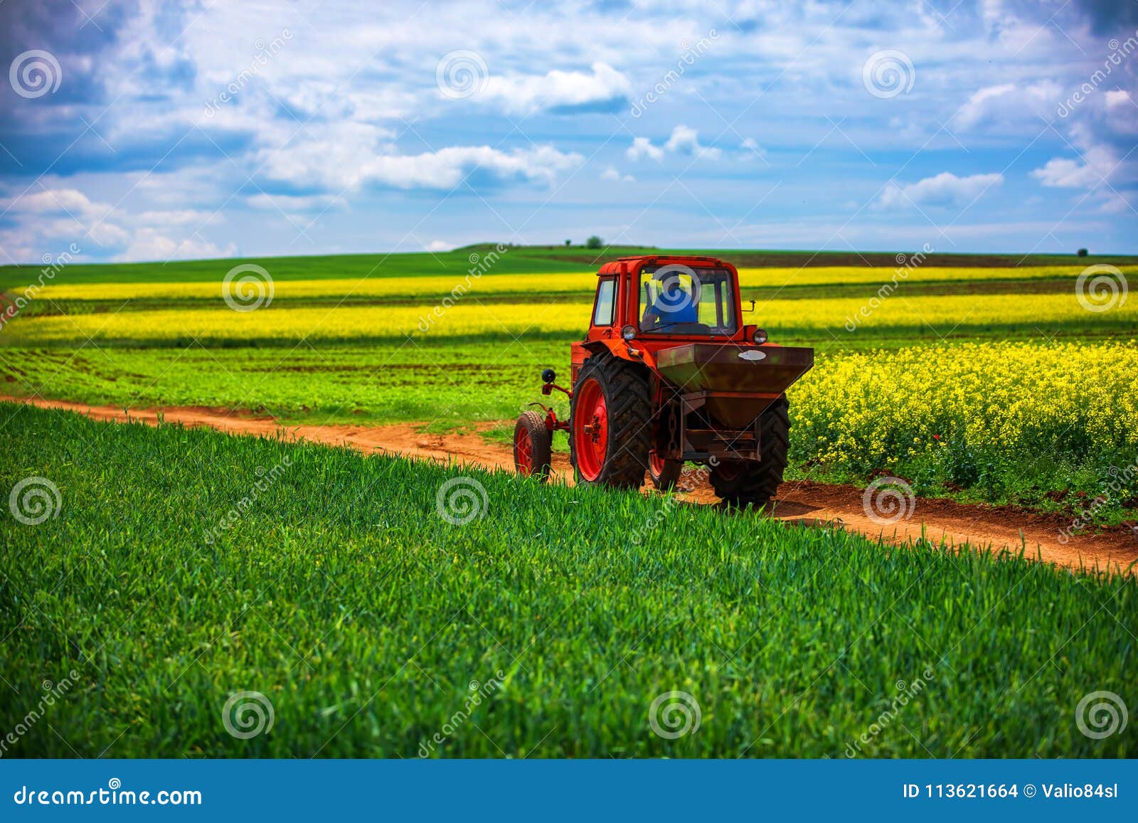 Tractor in a Agricultural Fields and Dramatic Clouds Stock Photo ...