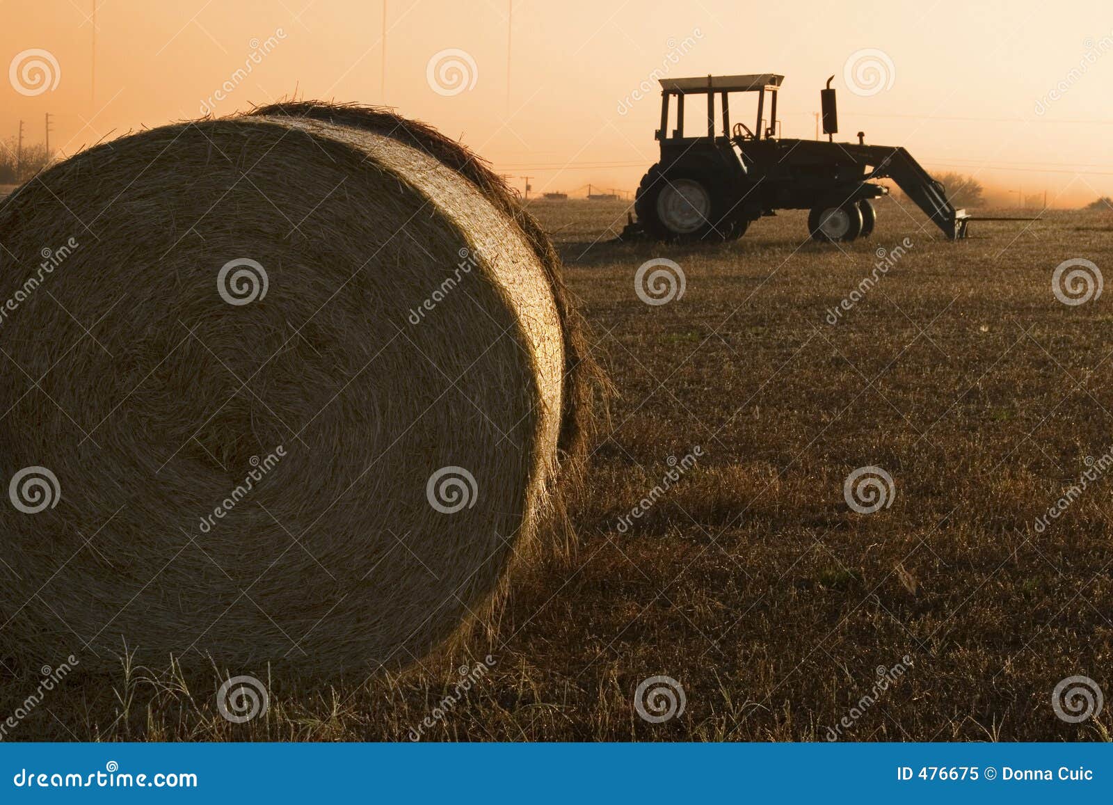 Tractor and bale of hay stock image. Image of farming, sunset - 476675