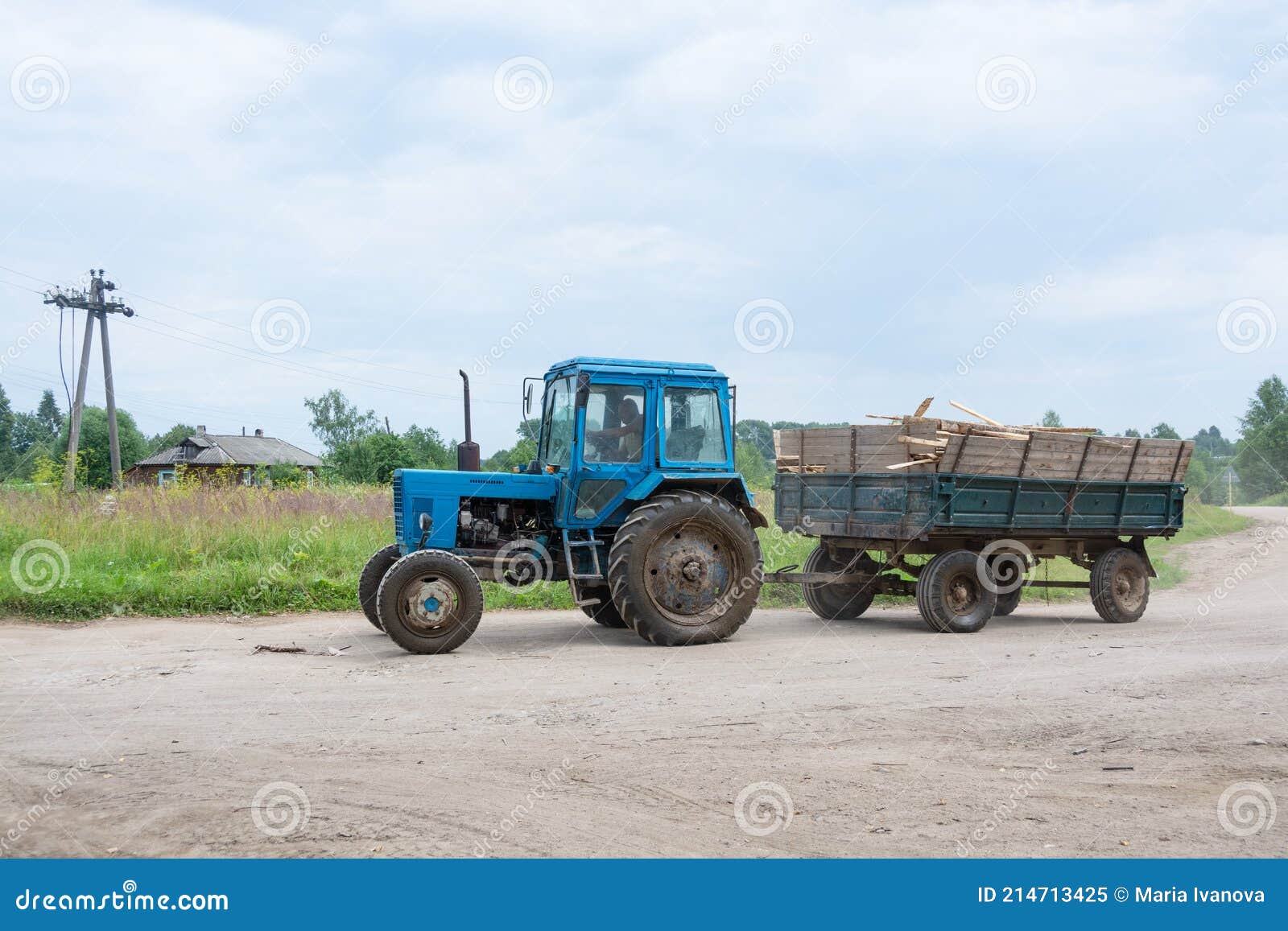 Tractor Belarus with a Trailer Rides on the Road. Stock Image - Image ...