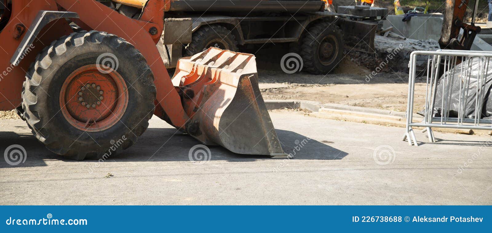 A Tractor With A Bucket On A Construction Site.Special Equipment For ...