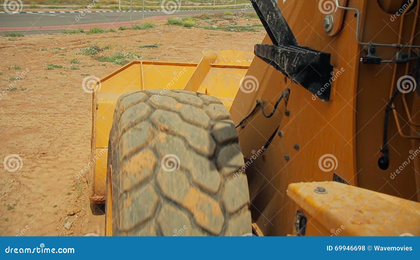 Tractor with a Bulldozer Moving Soil at a Construction Site Stock ...
