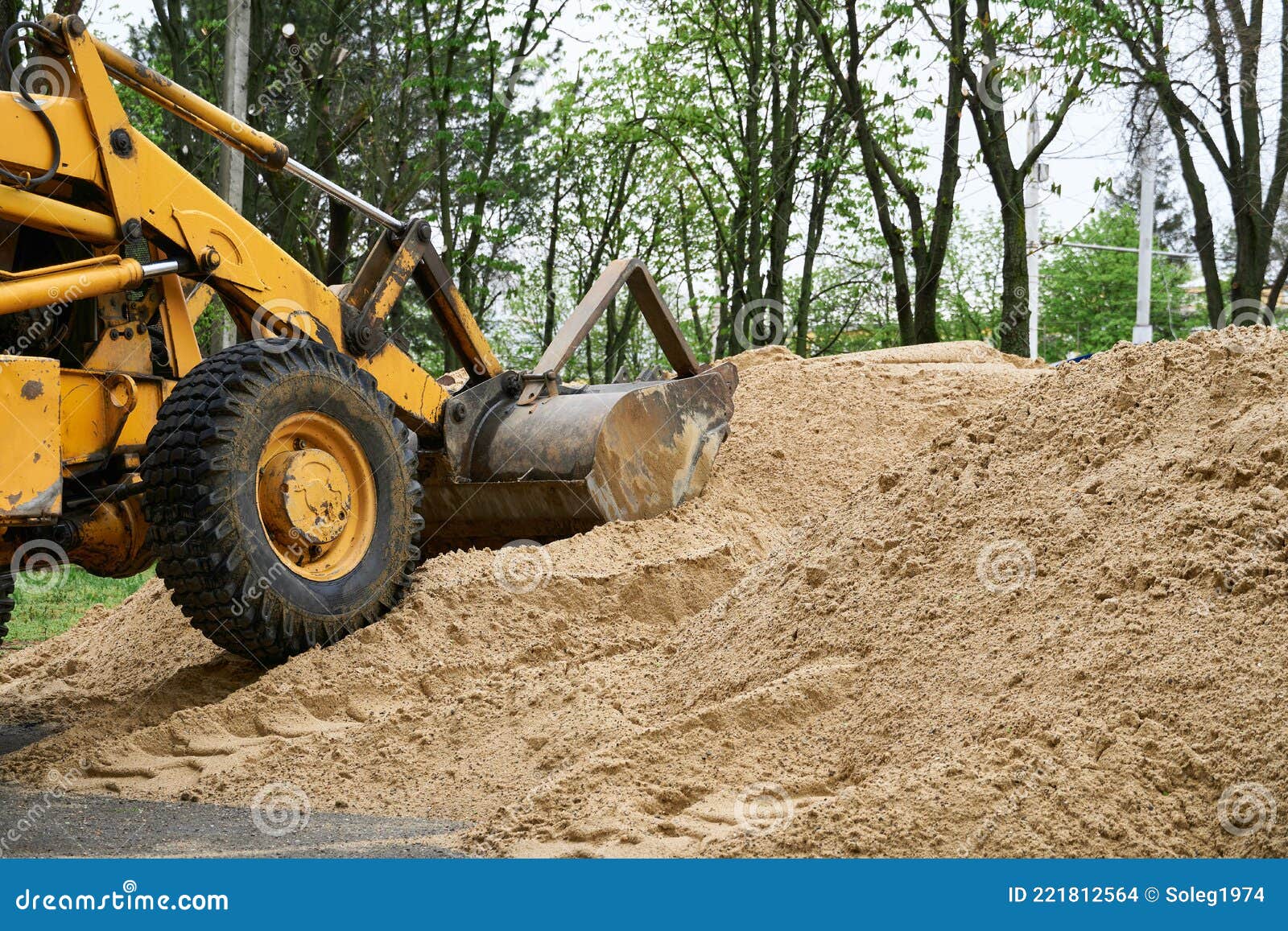 Tractor or Bulldozer Works with a Pile of Sand for Construction Stock ...