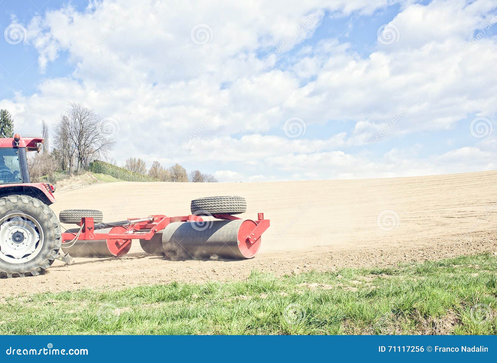 Tractor Compresses the Soil after Planting with Rollers. Stock Photo ...