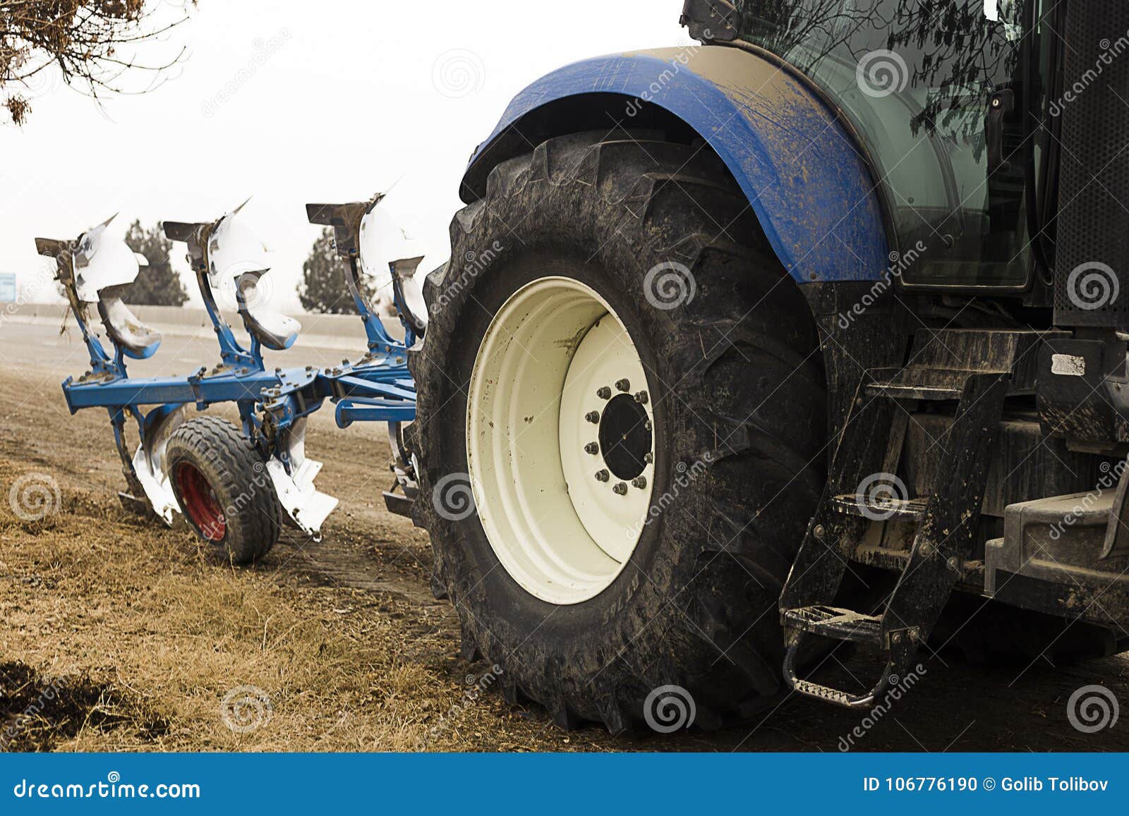 Tractor. Cropped Image of Modern Farm Equipment in Field Stock Photo ...