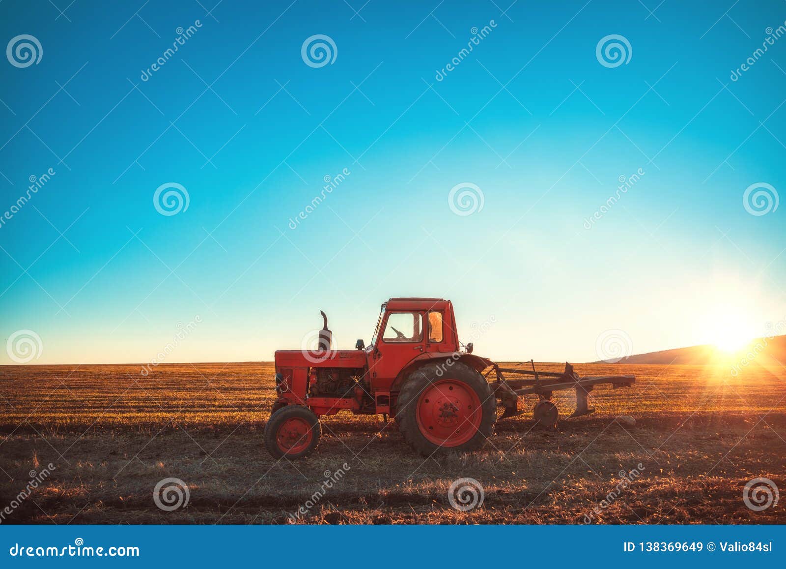 Tractor Cultivating Field at Spring during Sunset Stock Image - Image ...