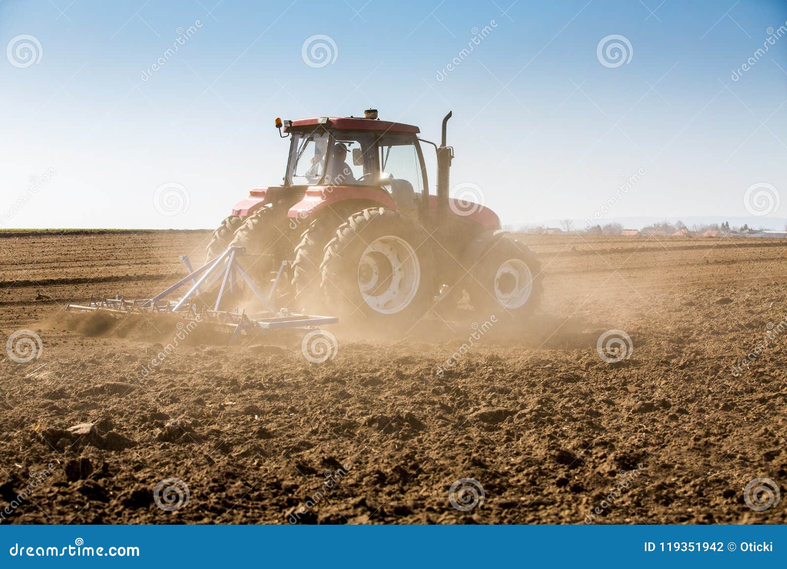 Tractor Cultivating Field at Spring Stock Photo - Image of farmer ...