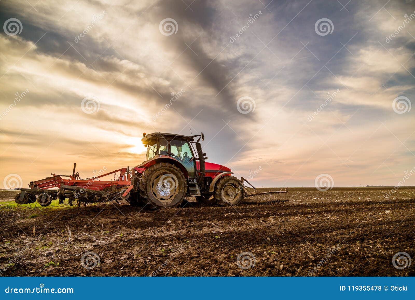 Tractor Cultivating Field at Spring Stock Photo - Image of plowed ...