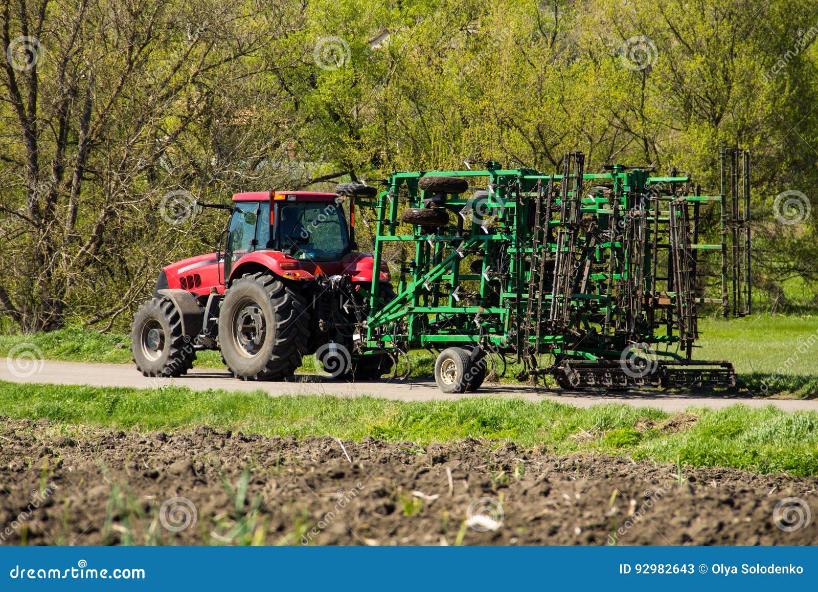 Tractor with Cultivator on Rural Road Stock Image - Image of farming ...