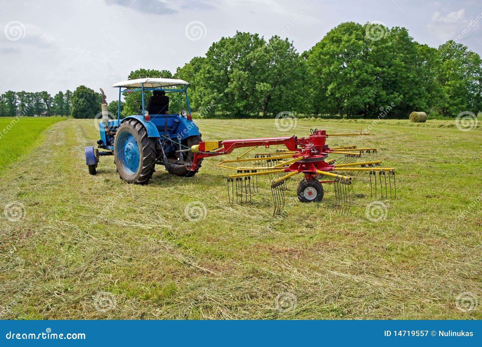 A tractor and cut hay stock image. Image of tractor, farm - 14719557