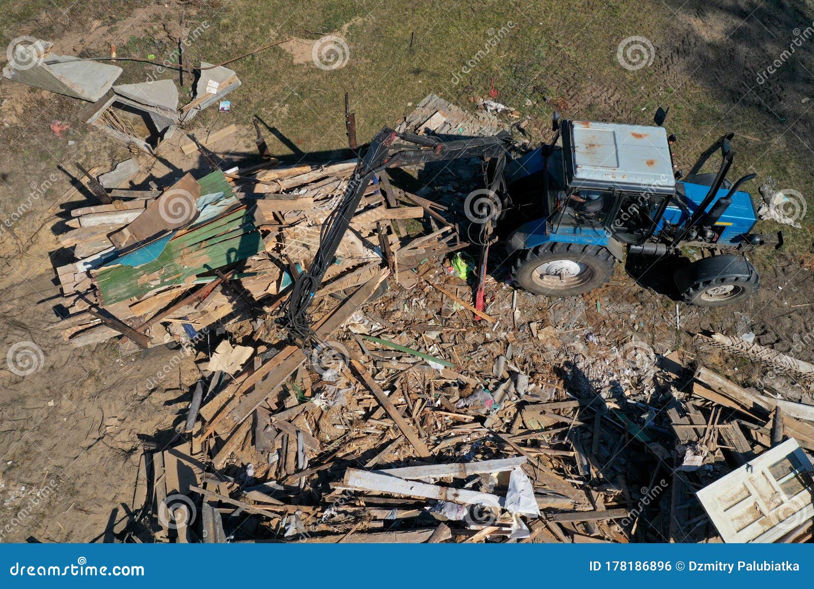 Tractor Disassembles the Rubble after the Destruction of the House ...