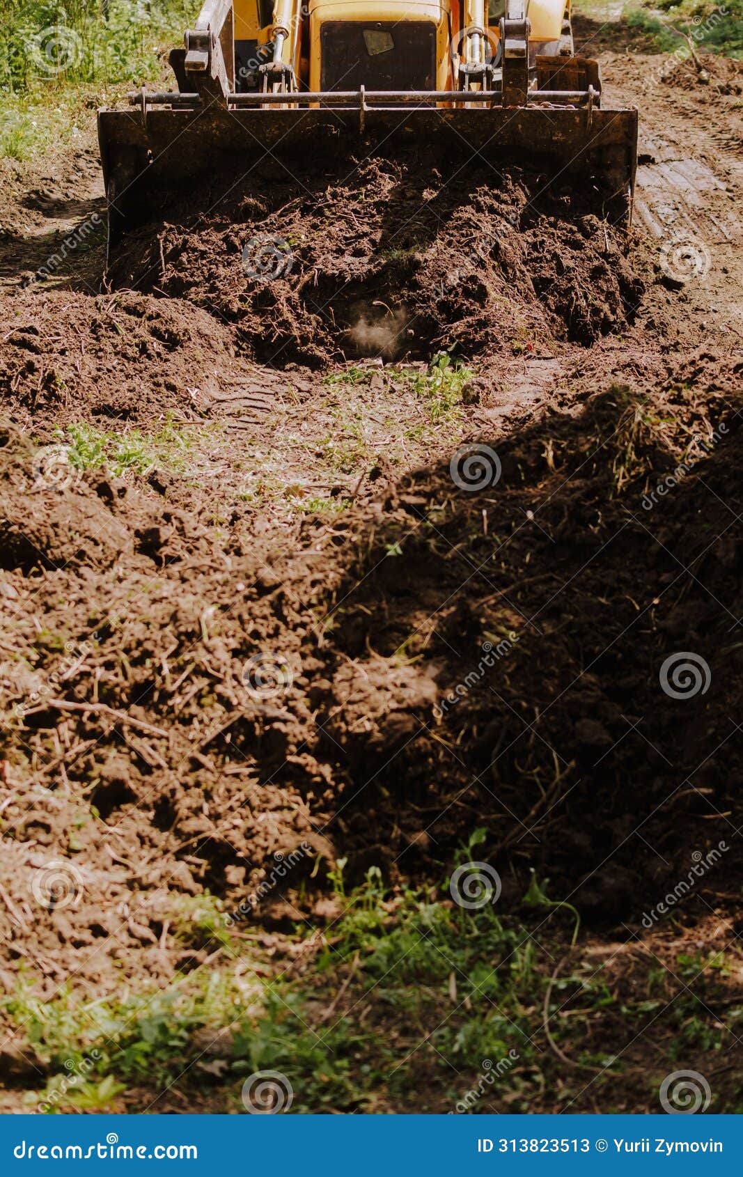 A Tractor Doing Land Leveling by a Private Cottage Stock Image - Image ...