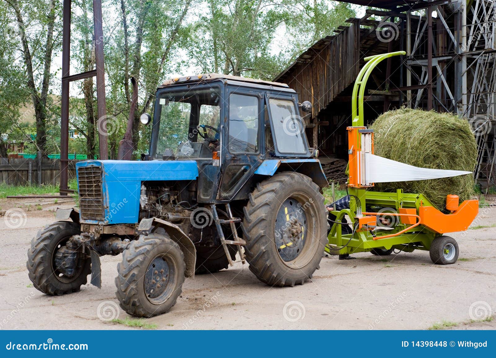 Tractor Drawn Machine for Packing Hay Stock Photo - Image of white ...