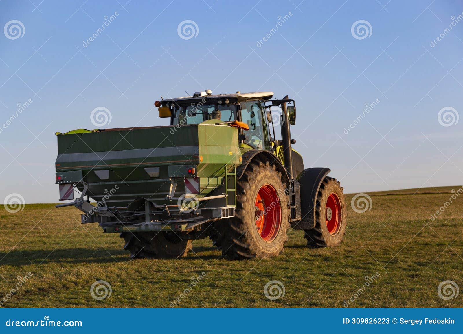 Tractor driving on a field stock image. Image of agricultural - 309826223