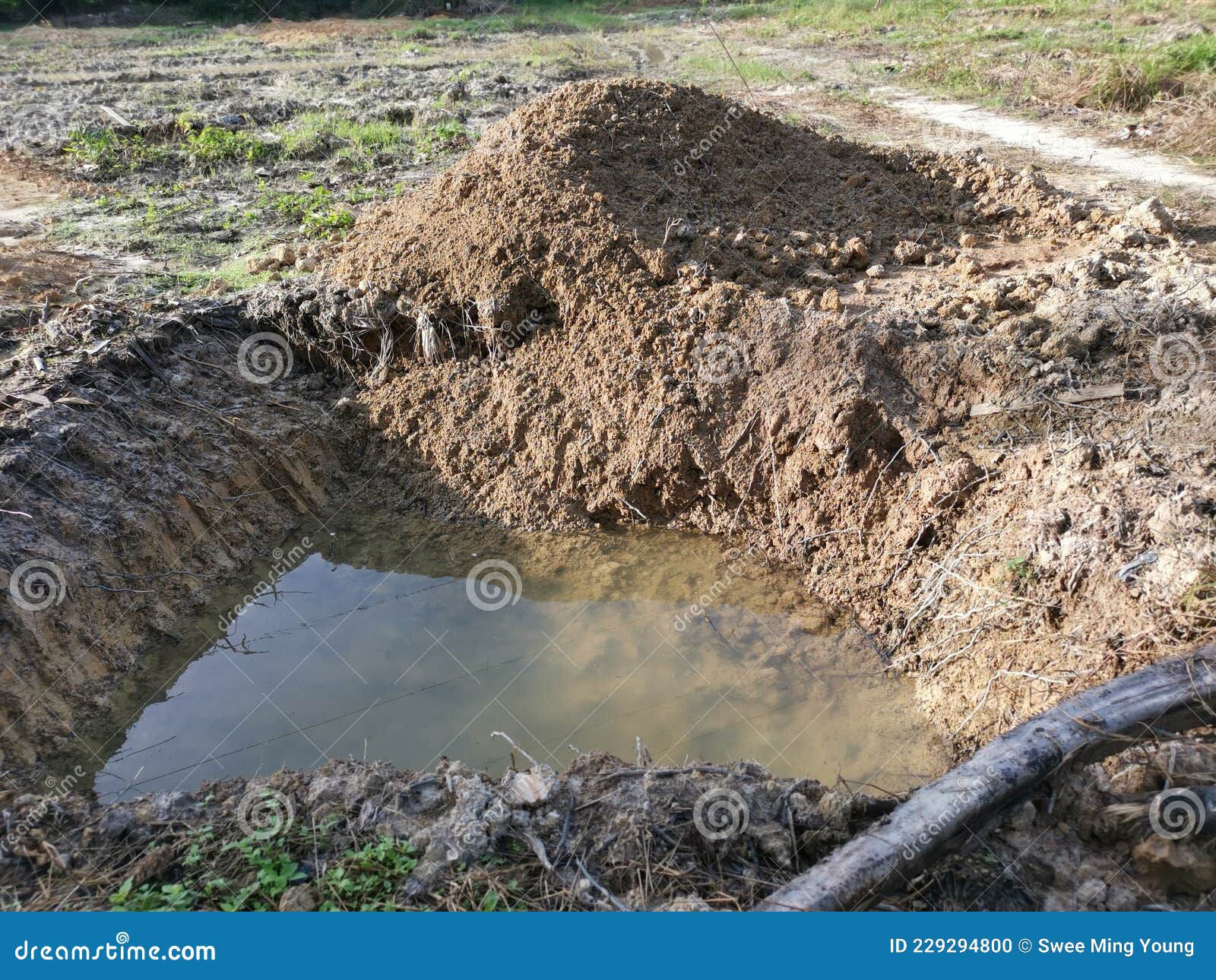 Tractor Dug Ditch Filled with Rain Water on the Land Stock Photo ...