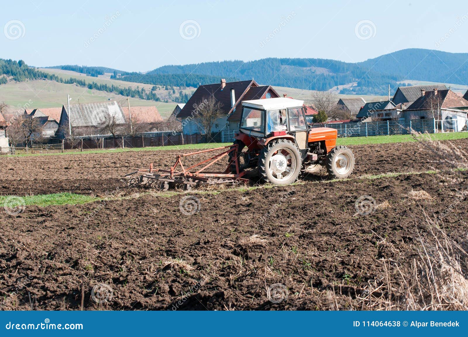 Tractor Equipped with Harrow Working Stock Photo - Image of farmers ...