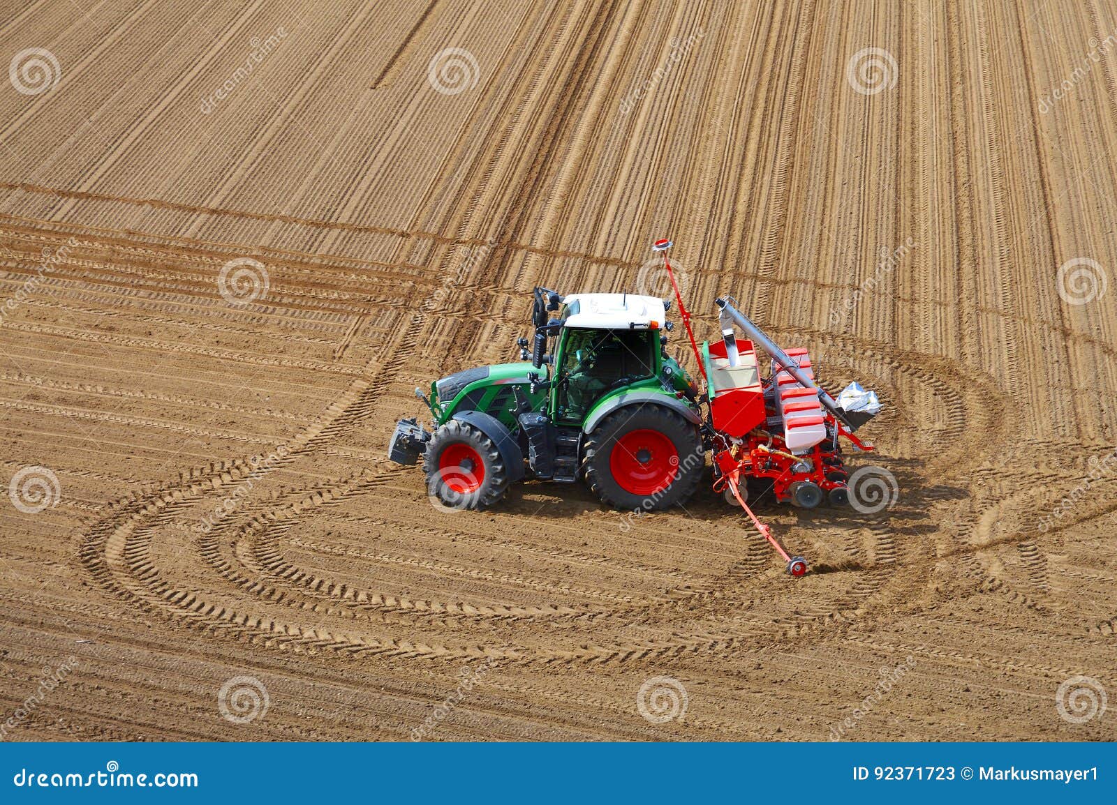 Green tractor in a field stock image. Image of farming - 92371723