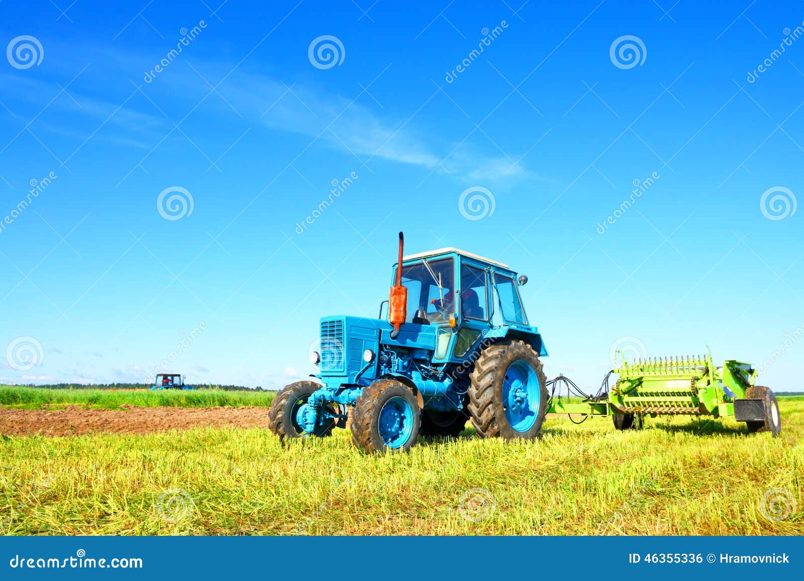Tractor on a farmer field stock photo. Image of blue - 46355336