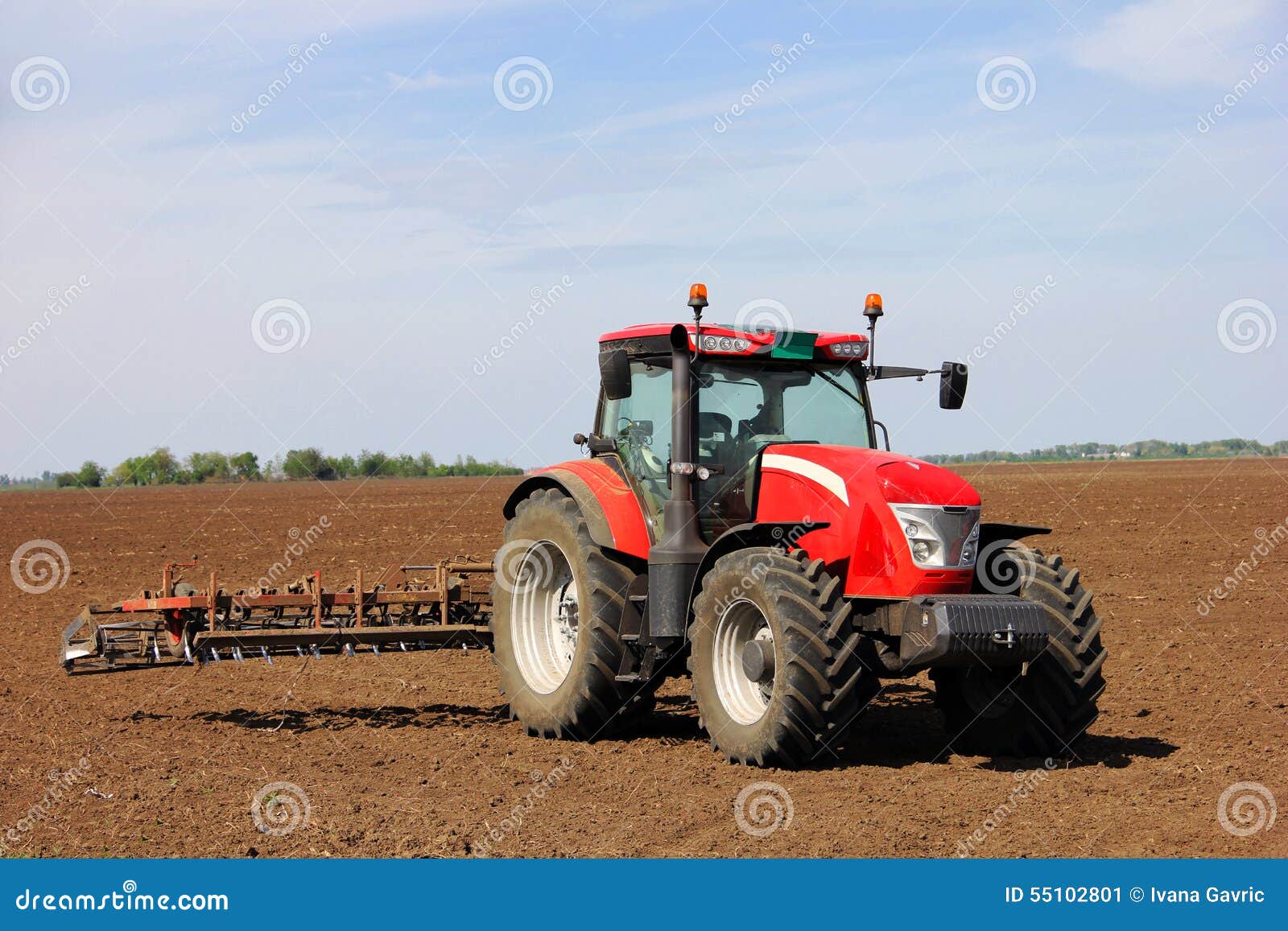 Tractor on a farmland stock image. Image of machinery - 55102801