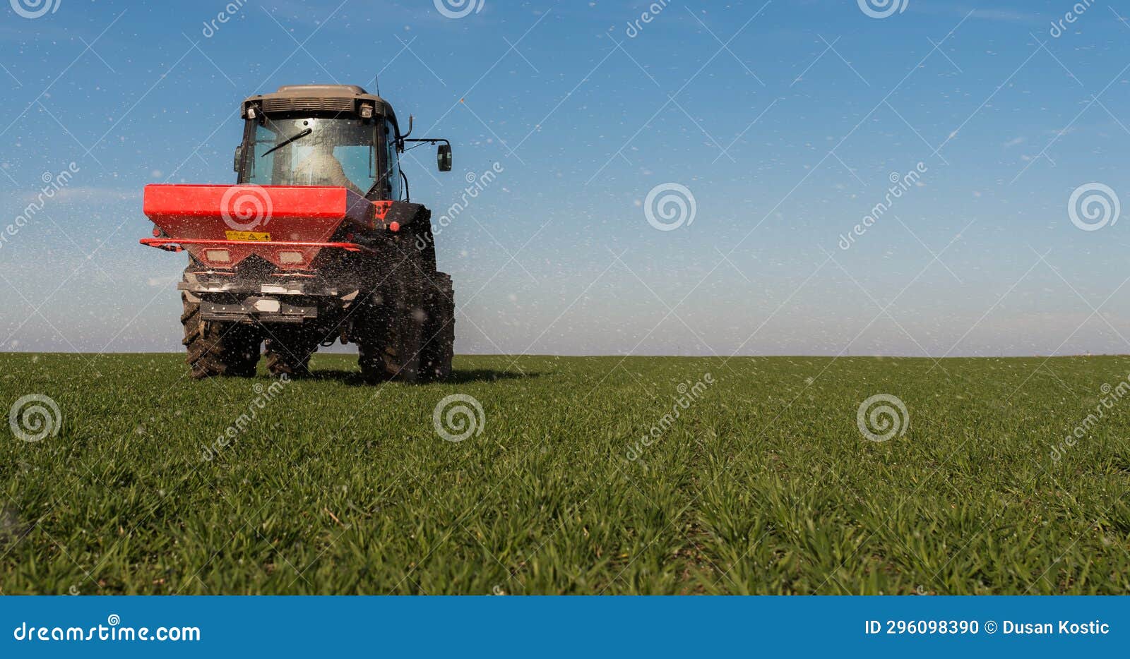 Tractor Fertilizing in Field Stock Photo - Image of agriculture ...