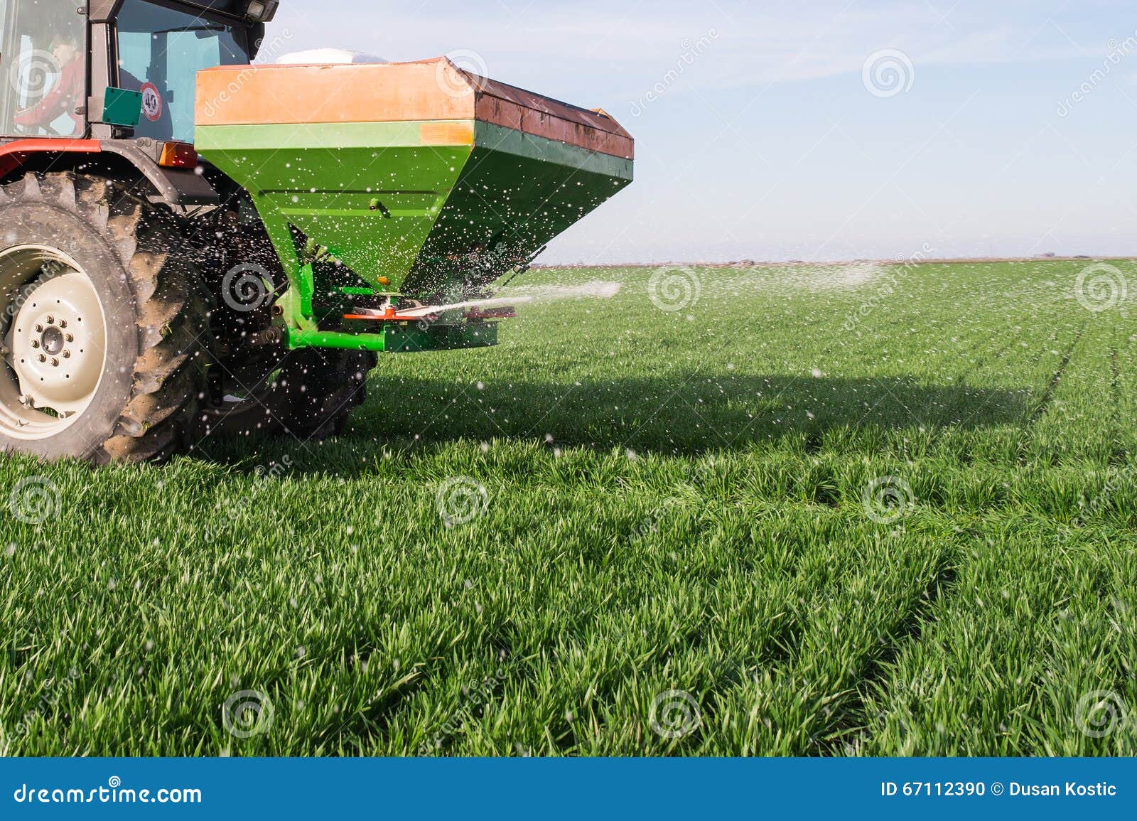 Tractor Fertilizing in Field Stock Photo - Image of crop, scene: 67112390