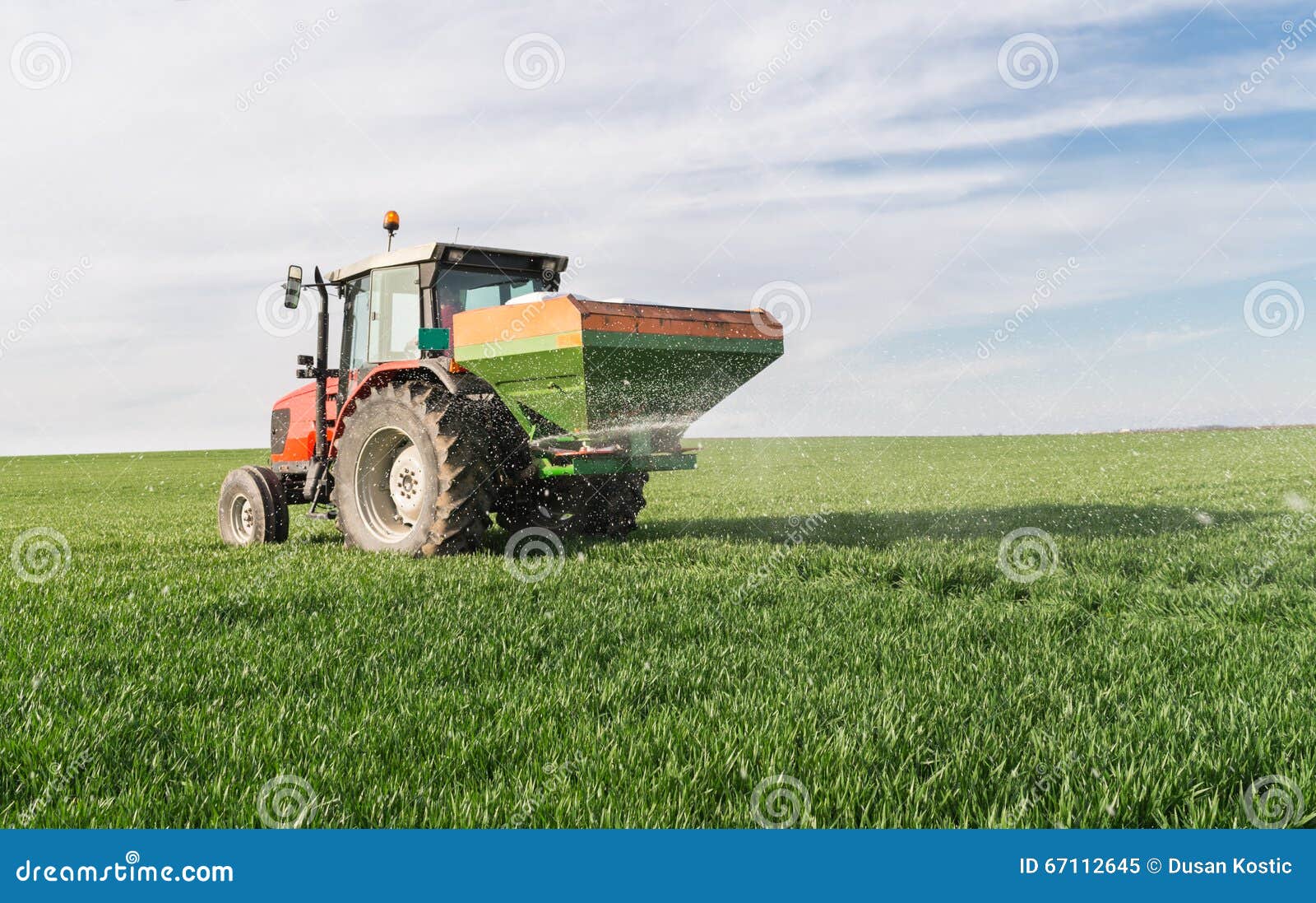 Tractor Fertilizing in Field Stock Image - Image of preparation, space ...