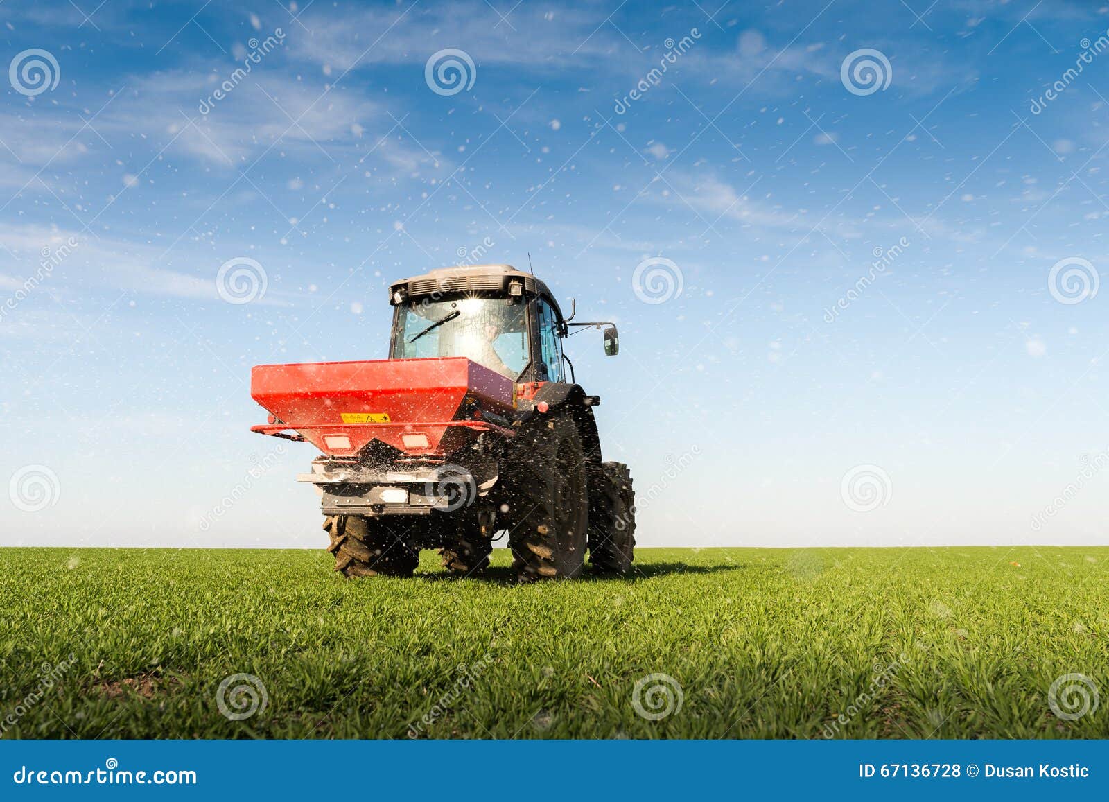 Tractor Fertilizing in Field Stock Photo - Image of farmland, spreader ...