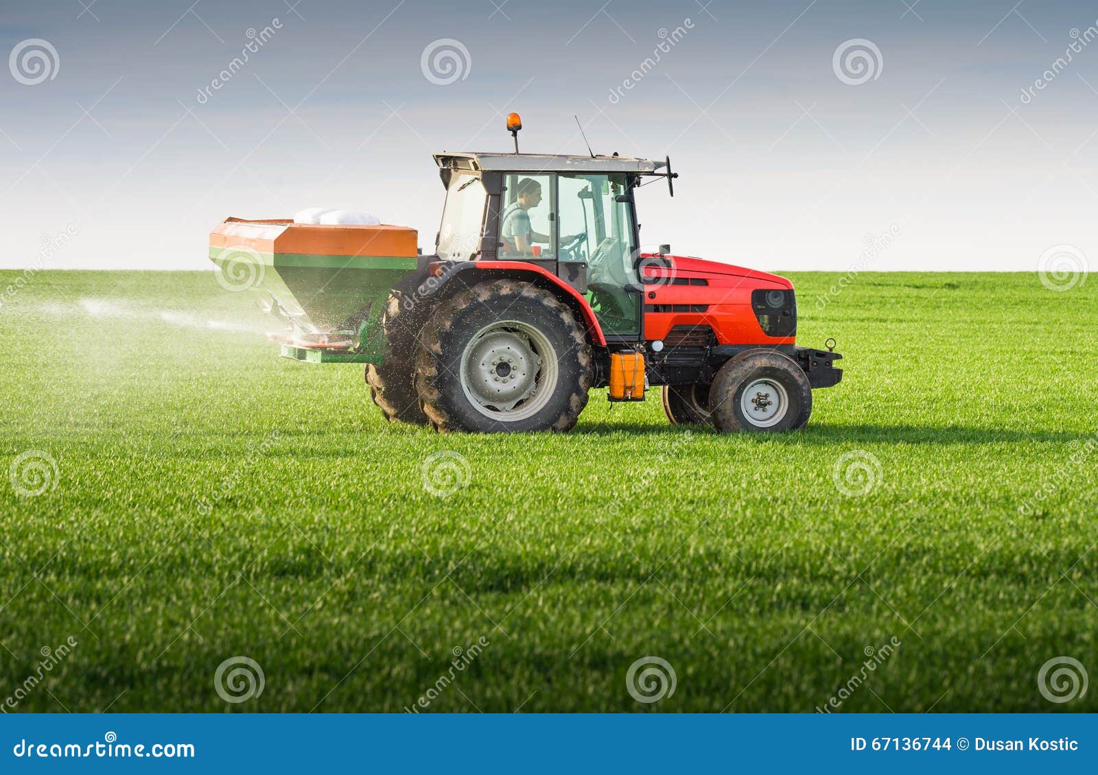 Tractor Fertilizing in Field Stock Photo - Image of crop, farming: 67136744